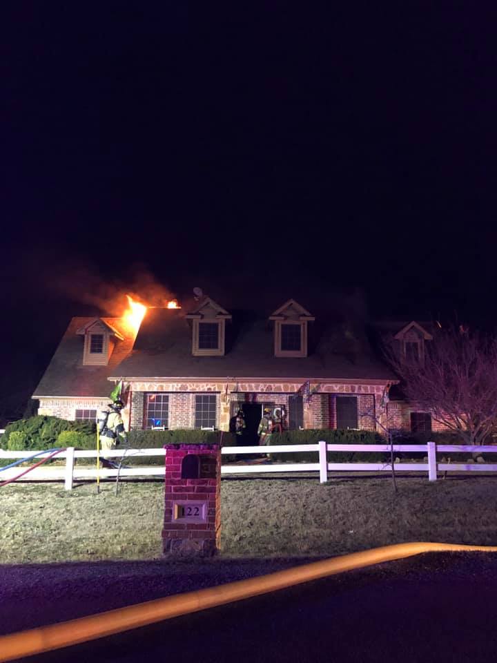 Parker County firefighters working a house fire outside of Springtown ...